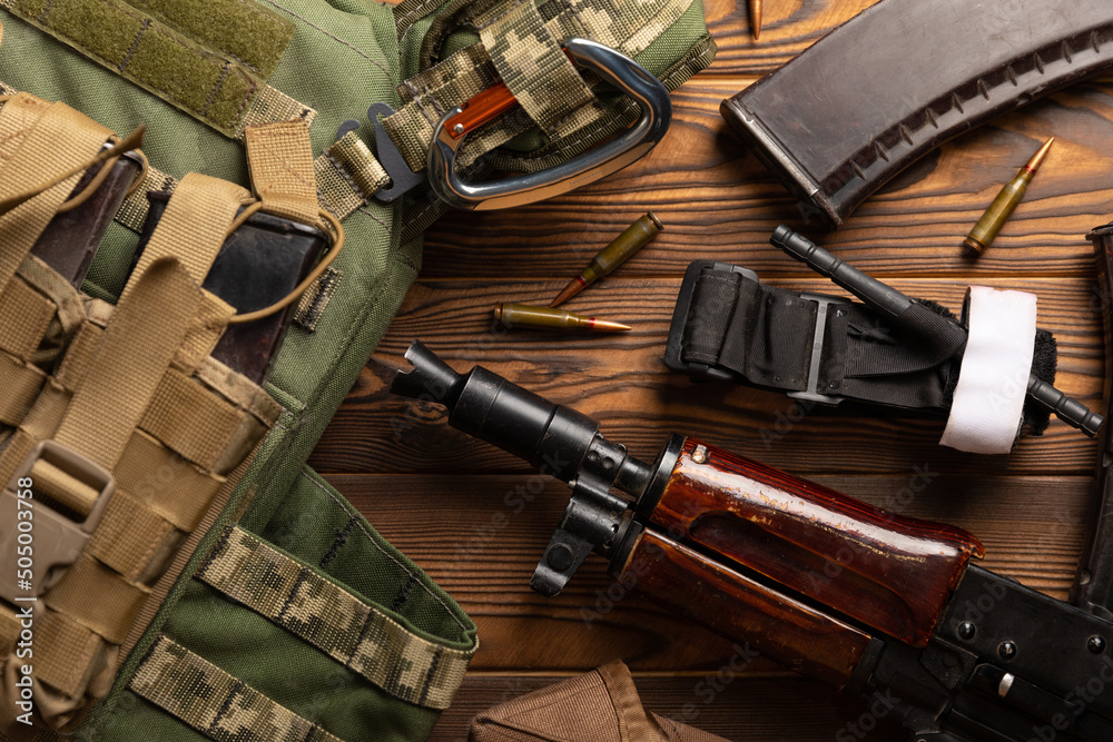 Army body armor, helmet and ammunition, Kalashnikov assault rifle with ...