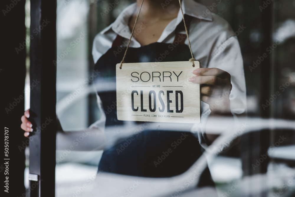 Asian young woman notice sign wood board label "SORRY WE ARE CLOSED ...