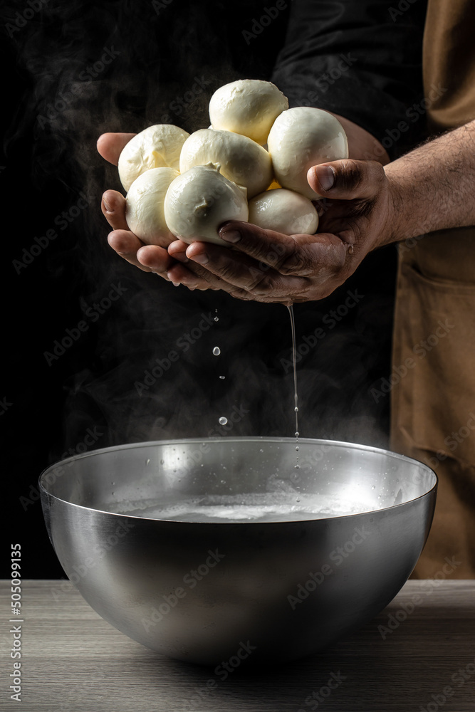 The homemade cheese maker produces handmade mozzarella with fresh bio ...