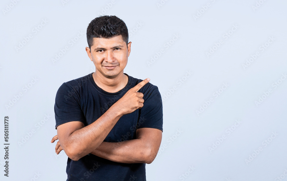 Foto de Smiling man pointing to a banner to the side, shocked guy ...