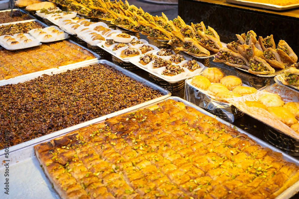 variety of arabic sweets and dessert, baklava in pastry and bakery shop ...
