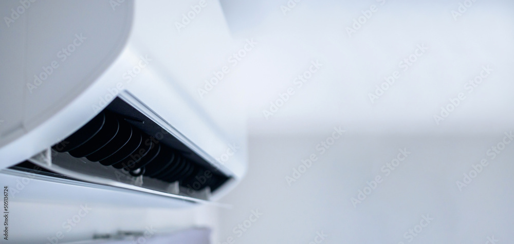 Air conditioner on white wall room interior background Stock Photo ...