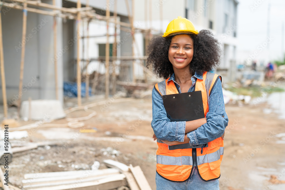 Portrait of Young female African American civil engineer wearing safety ...