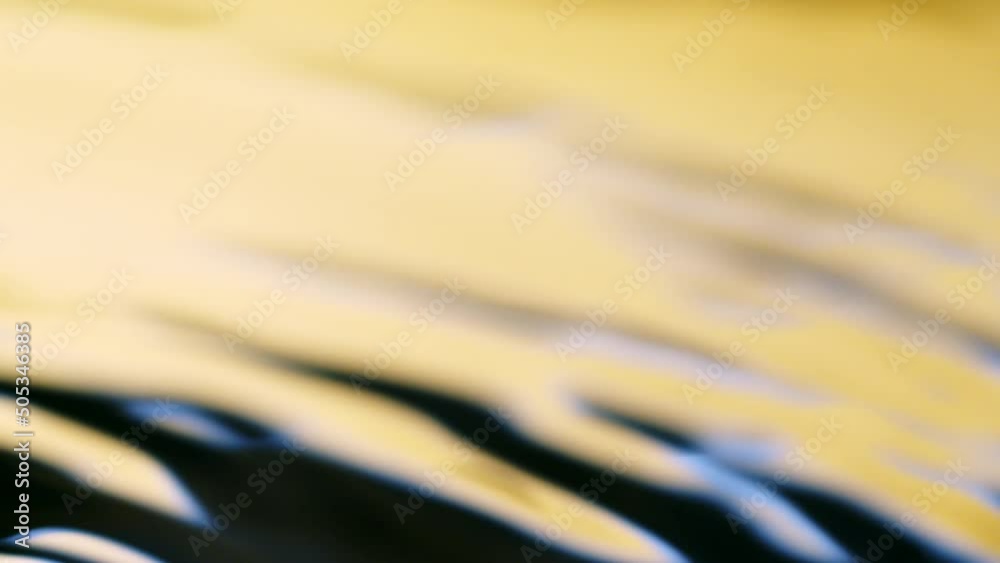 Water surface yellow and blue texture with clean ripples and wave ...