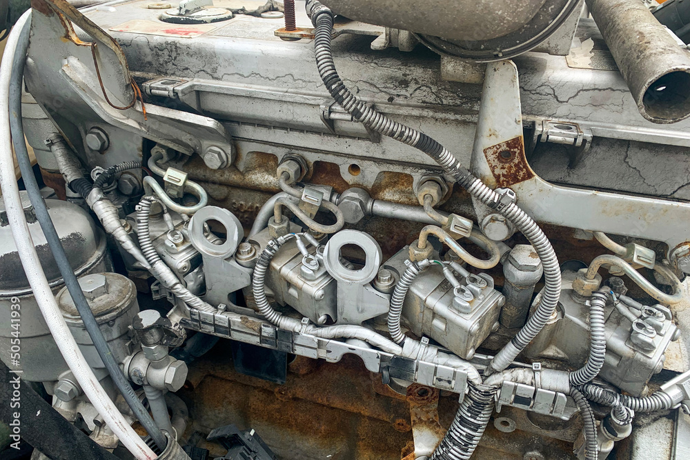 Closeup of salvage yard of broken cars parts, dirty engine of crashed ...