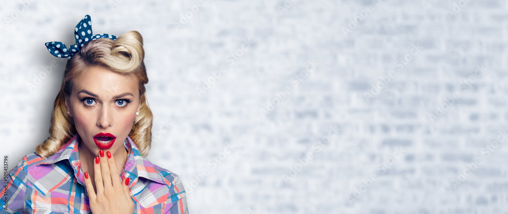 Unbelievable news! Excited surprised blond woman. Girl pin up with open ...