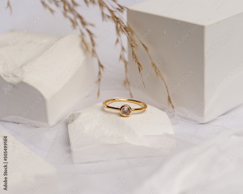 Wedding ring set on white stone. The jewelry ring is ready to be ...