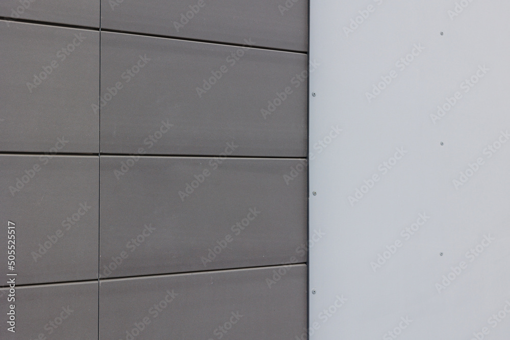 building facade with ventilated facade tiles installed. Modern ...