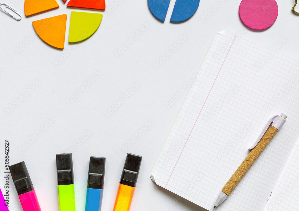 School supplies, open notepad, rulers, fractions on a white background ...