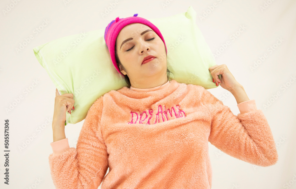 cute young Asian white woman wearing pink pajamas and a night cap ...