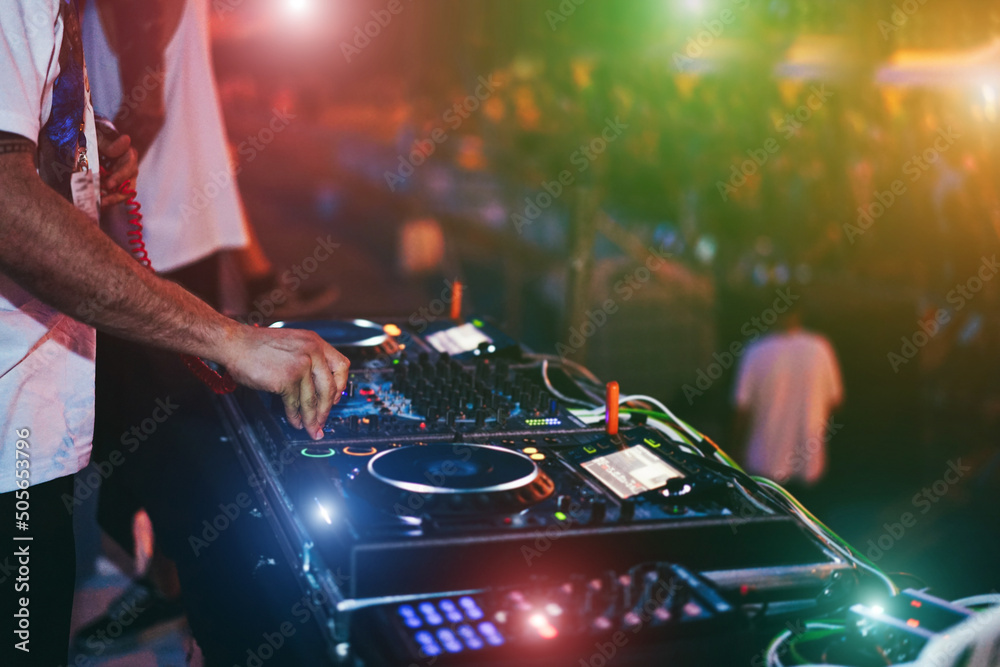 Dj mixing at beach night party during summer vacation outdoor - Focus ...