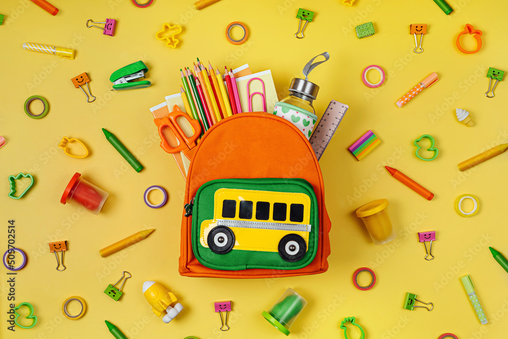 Kids Backpack with school bus on yellow background. Opened School ...