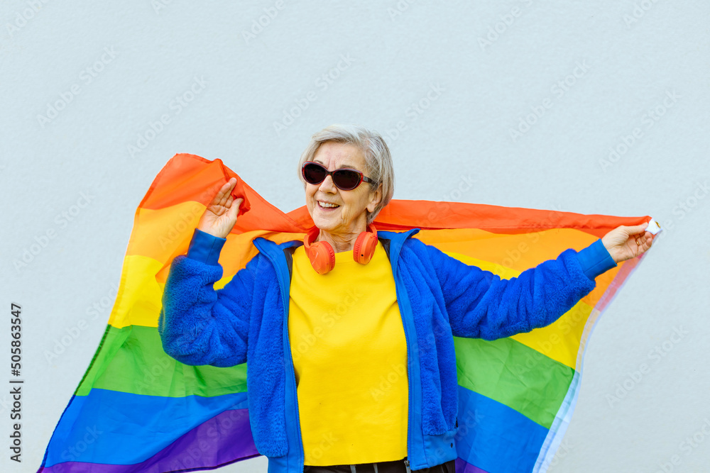 Happy 80 Years Old Woman Dressed Colorfully In Sunglasses Proudly