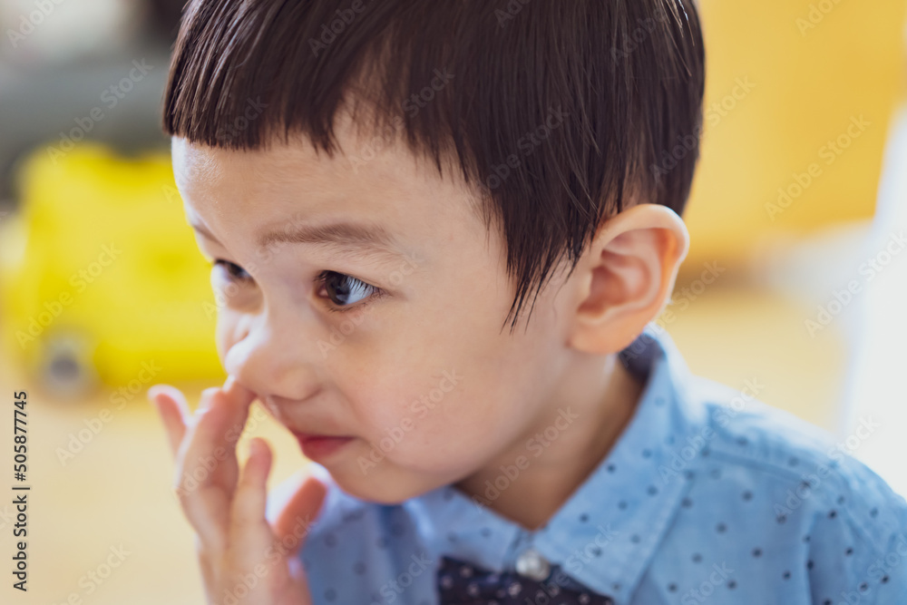 baby picking nose. little baby boy with finger in his nose. Cute little ...