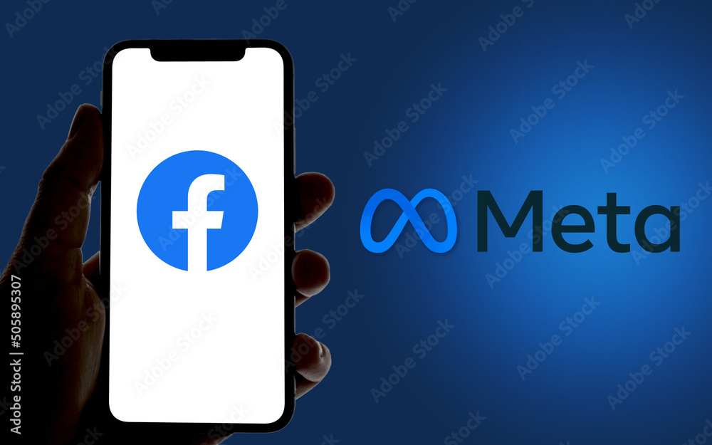 facebook logo is displayed on a smartphone, with the logo of the meta ...