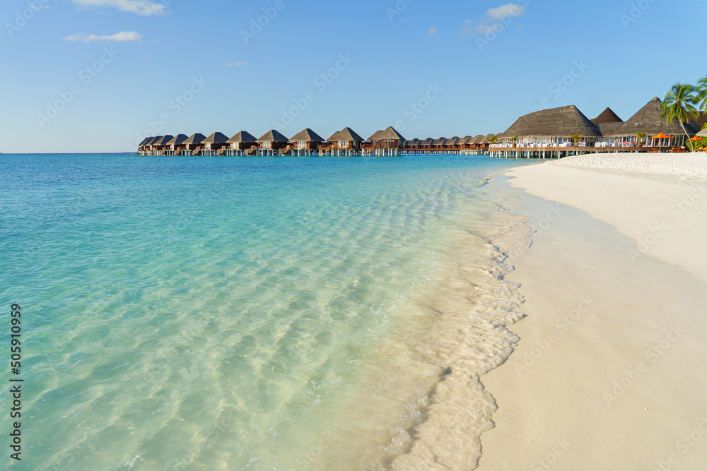 Beach with palm trees and crystal clear water. Idyllic tropical island ...