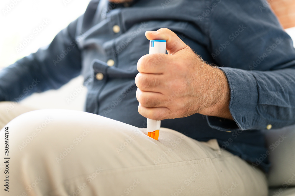 Man Injecting Epinephrine Using Auto-injector Syringe Stock Photo ...