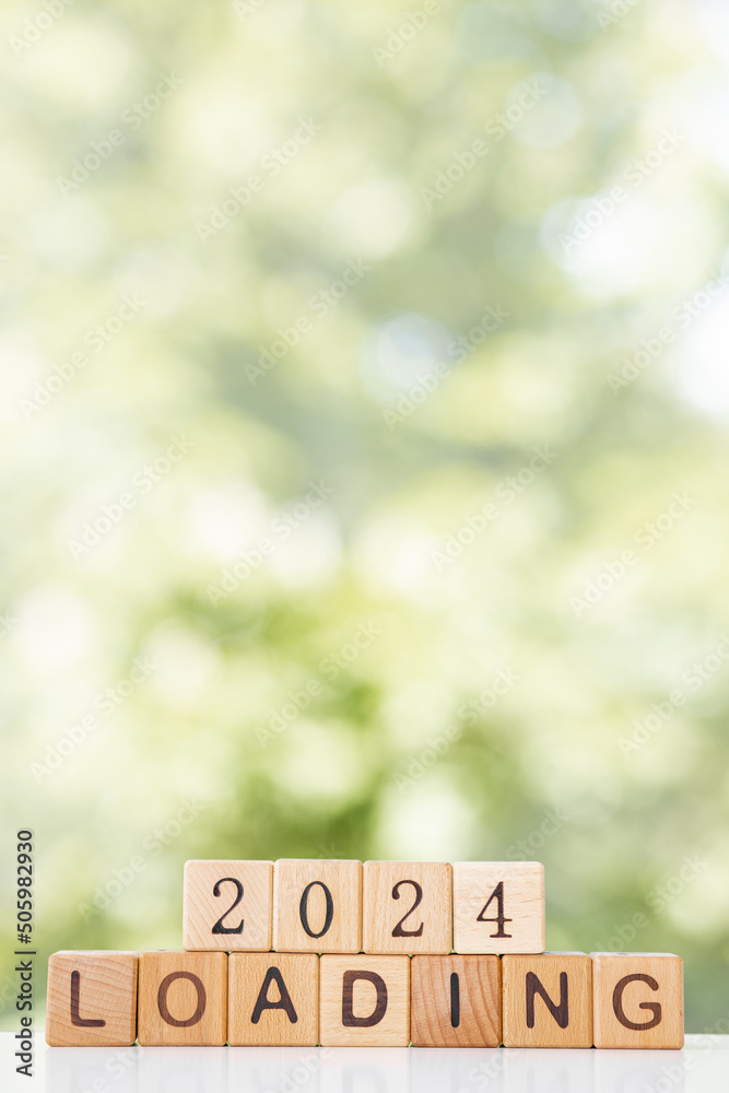 2024 New Year Loading. Loading new year 2023 with wood cube in progress ...