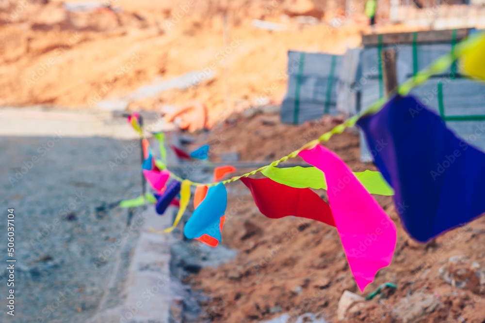 Flags colored pink red blue fence open air. Industrial place ...