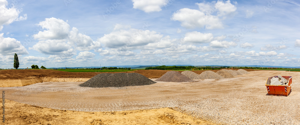 entrance construction site, driveway of building site. Pile of sand and ...