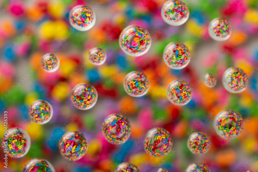 Bright and playful water droplet reflections capturing a rainbow of ...