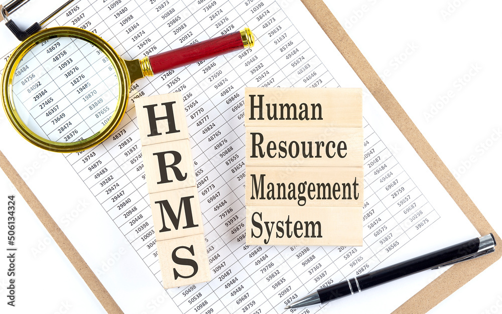 HRMS Human Resource Management System text on wooden block on chart ...