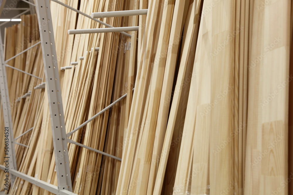 Planed wooden planks stack vertical storage in perspective. Carpentry ...