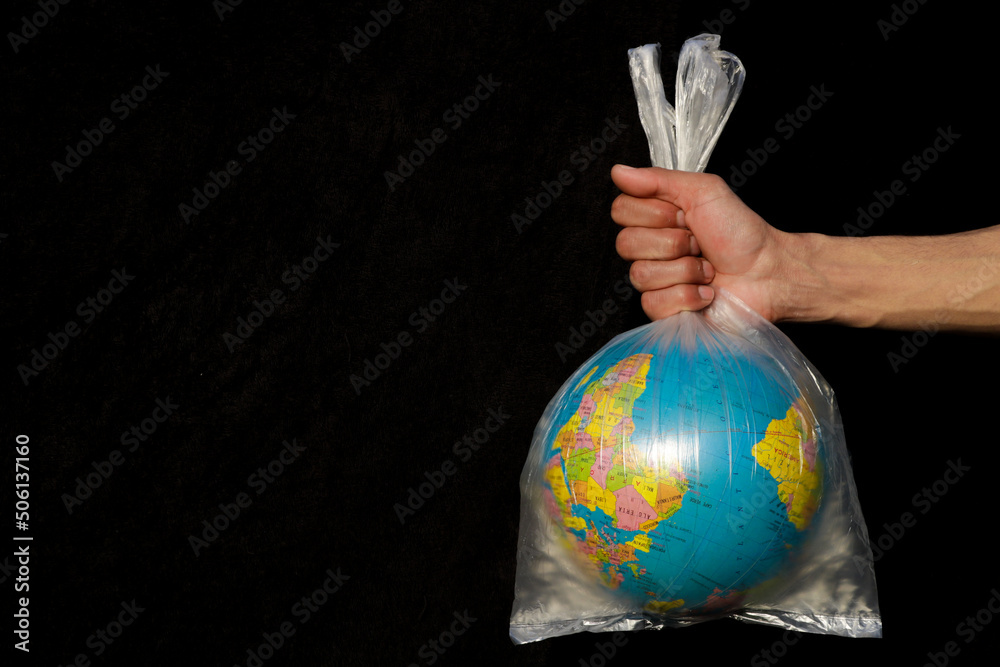 Earth wrapped up in plastic bag. Globe in a plastic bag. Concept of ...