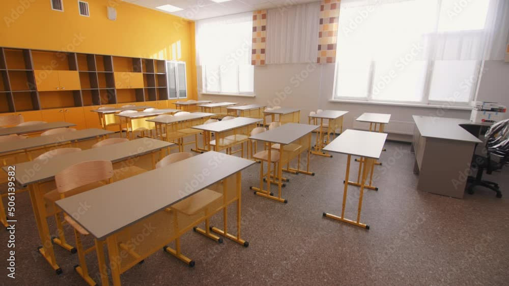 Empty classroom with desks for junior students teacher workplace and ...