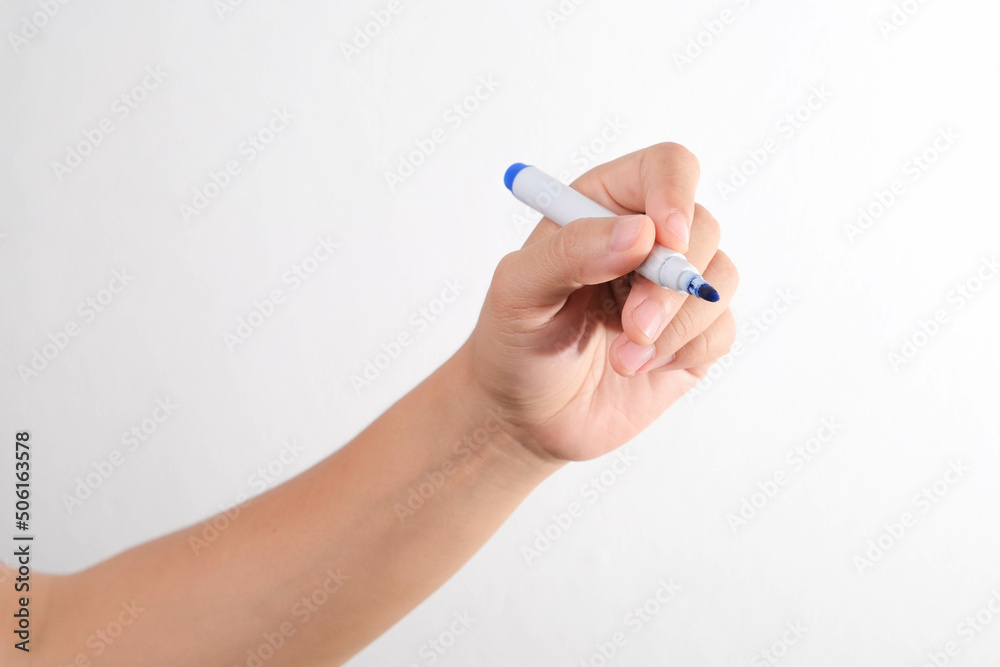 Female hand holding a blue marker isolated on white background. Female ...