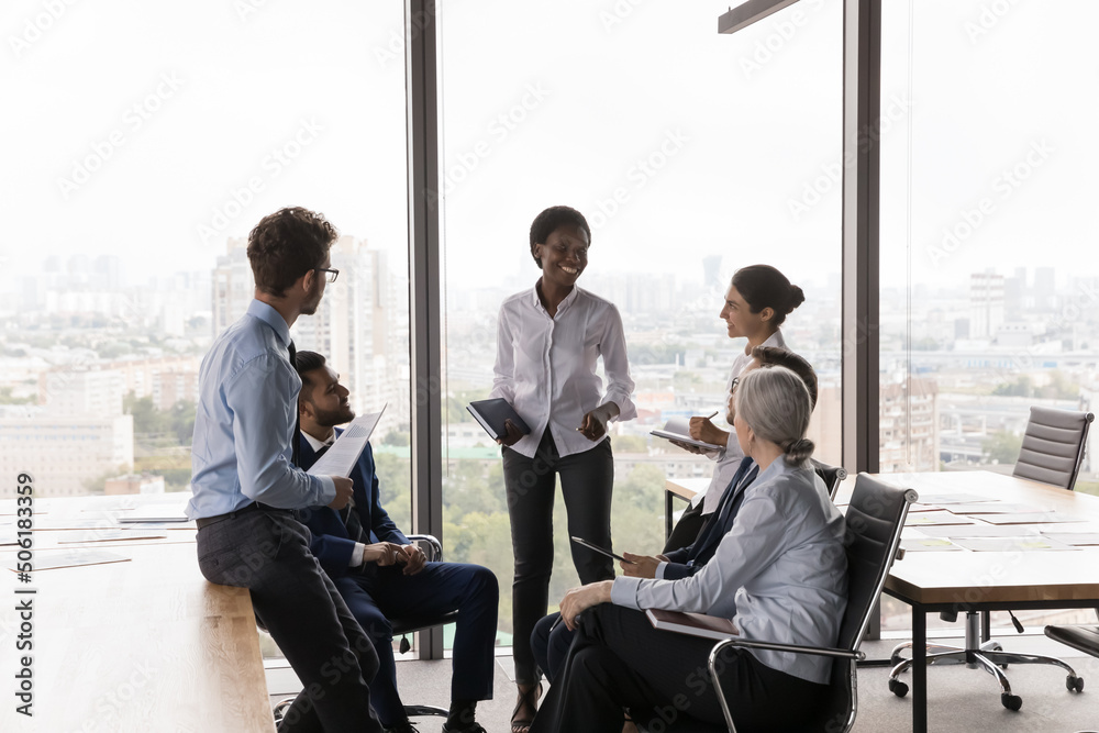 African woman, business coach makes speech, explain project details to ...