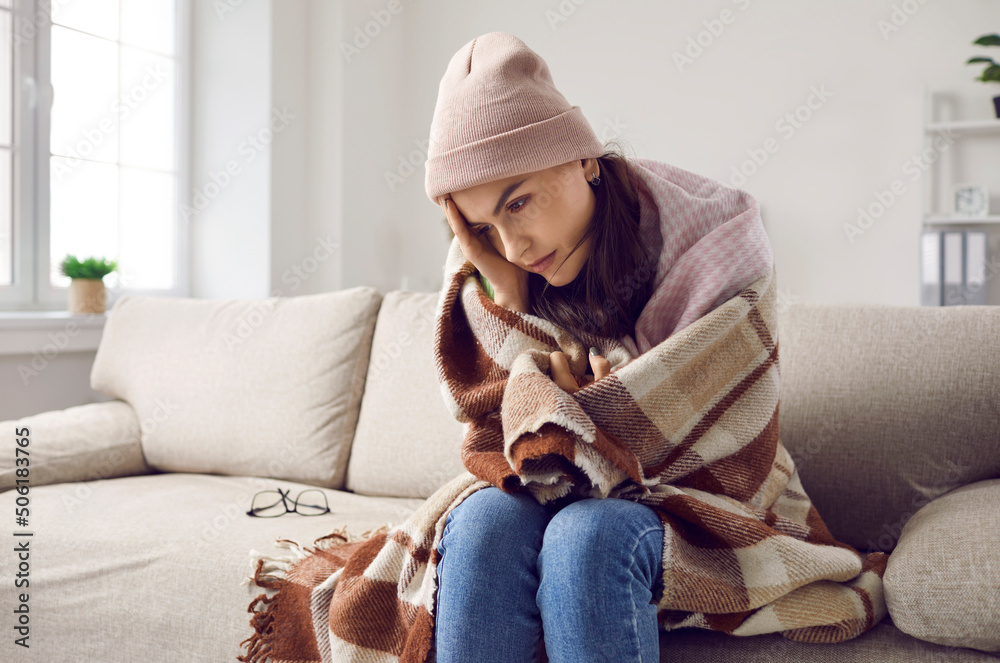 It's cold in the house in winter. Woman freezing because of fever or ...
