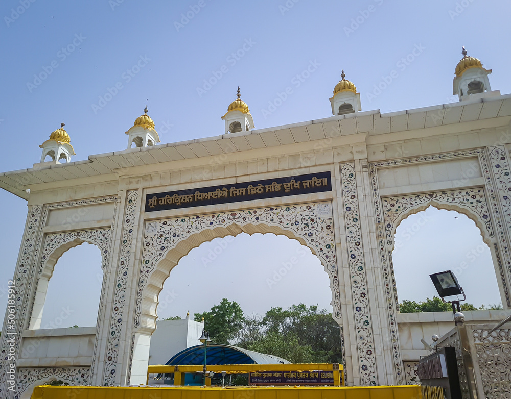 isolated gurudwara building entrance gate with flat sky at morning from ...