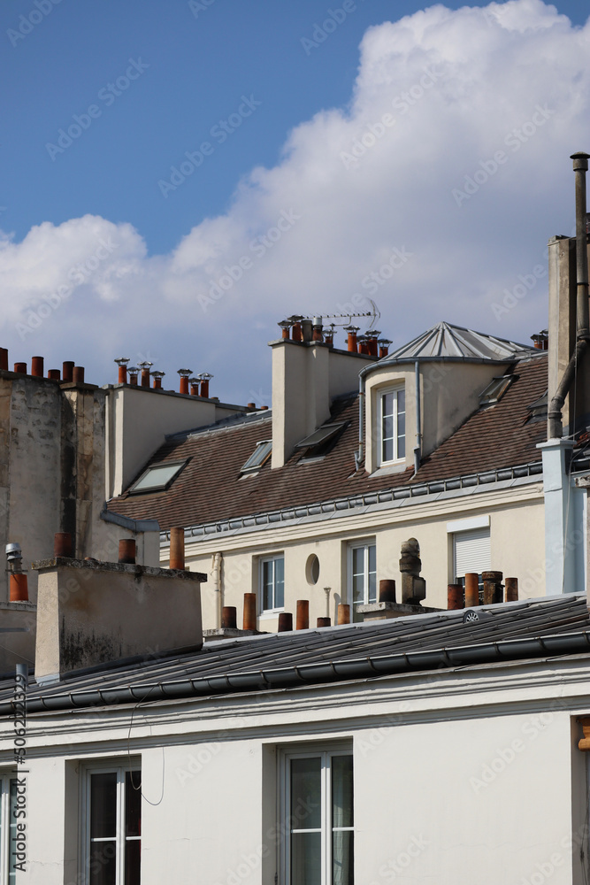 The famous Parisian attics (mansard roofs) on the top floors of 19th ...
