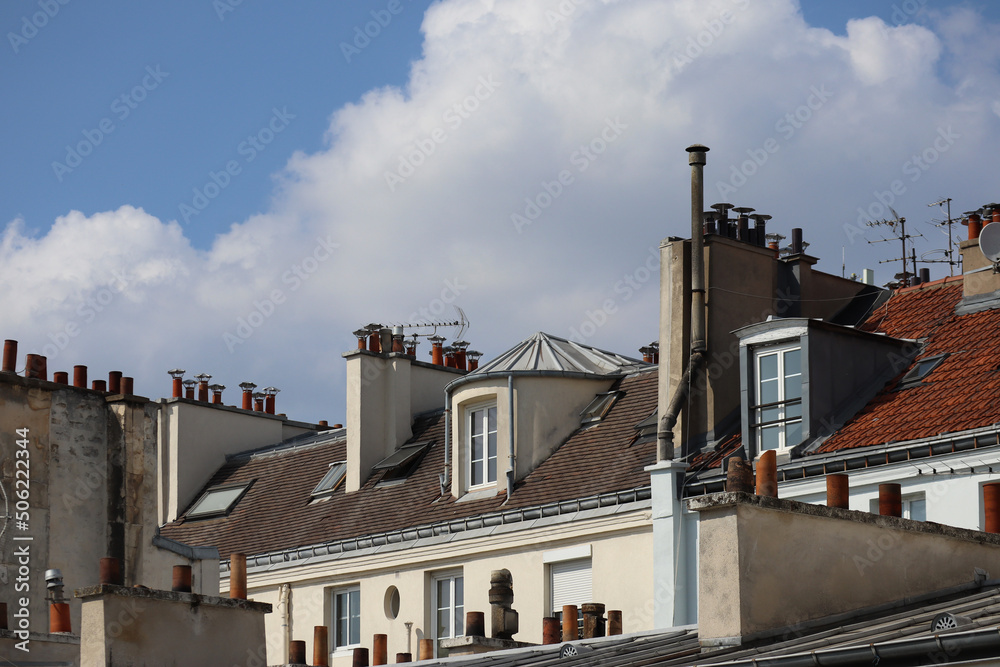 The famous Parisian attics (mansard roofs) on the top floors of 19th ...