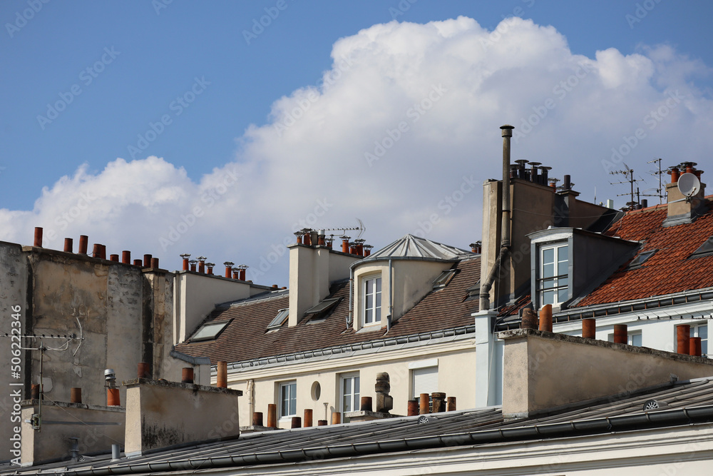 The famous Parisian attics (mansard roofs) on the top floors of 19th ...