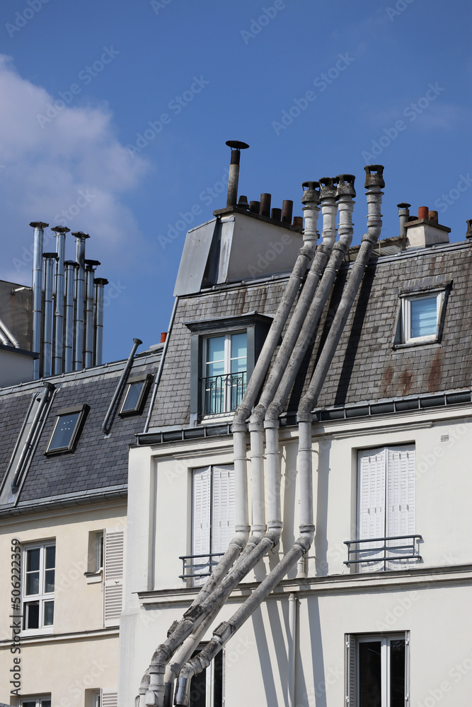 The famous Parisian attics (mansard roofs) on the top floors of 19th ...
