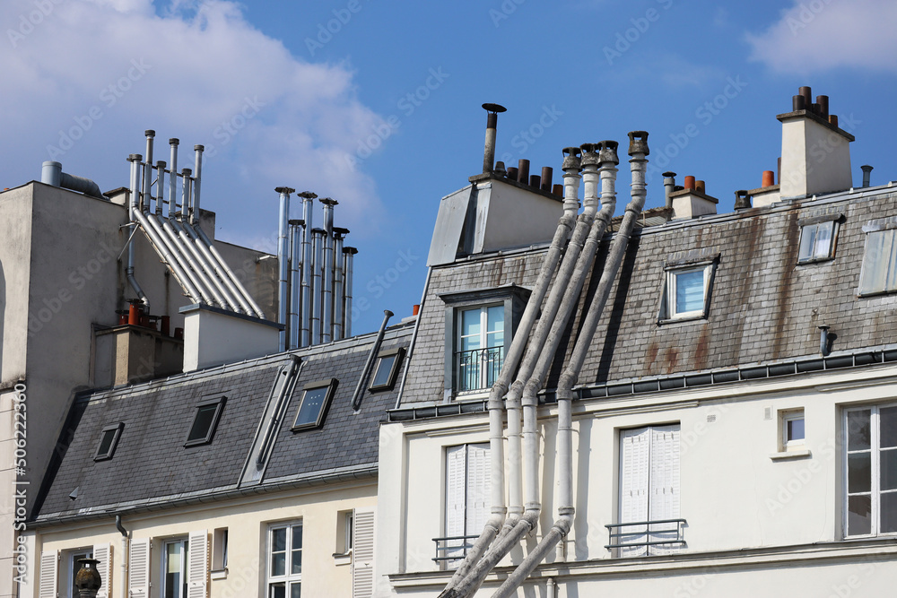 The famous Parisian attics (mansard roofs) on the top floors of 19th ...