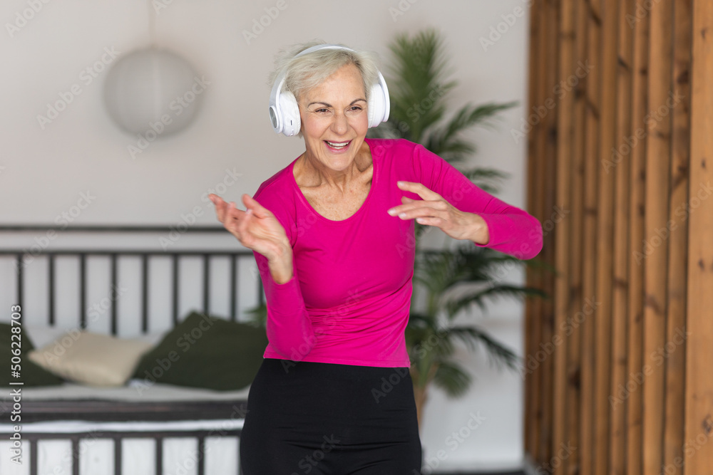 Beautiful senior woman with short grey hair and lovely smile listening ...