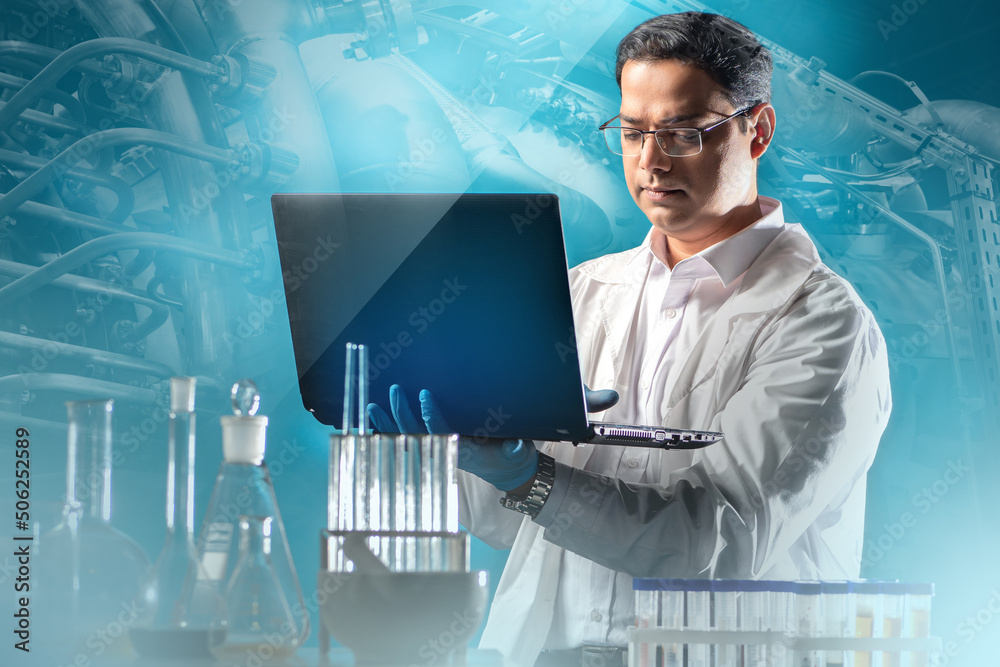 Biologist with laptop. Man is engaged in microbiology. Blurred test ...