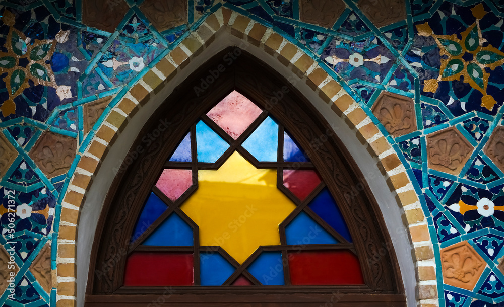 colourful stained glass with window arch frame at mosque. decoration of ...