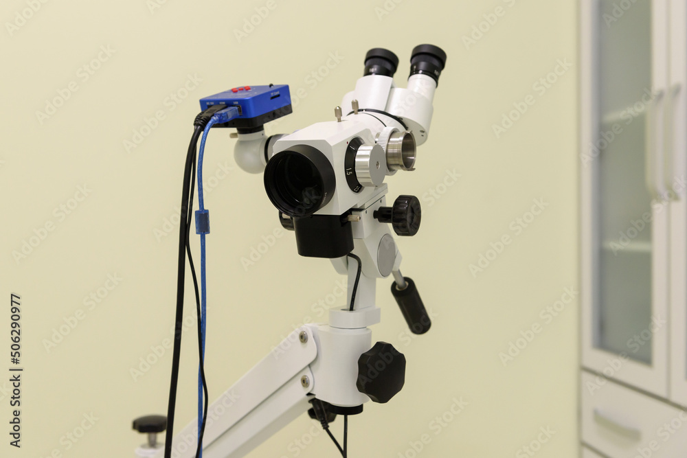 Colposcope in the gynecologist's office. Videocolposcopy of the cervix ...