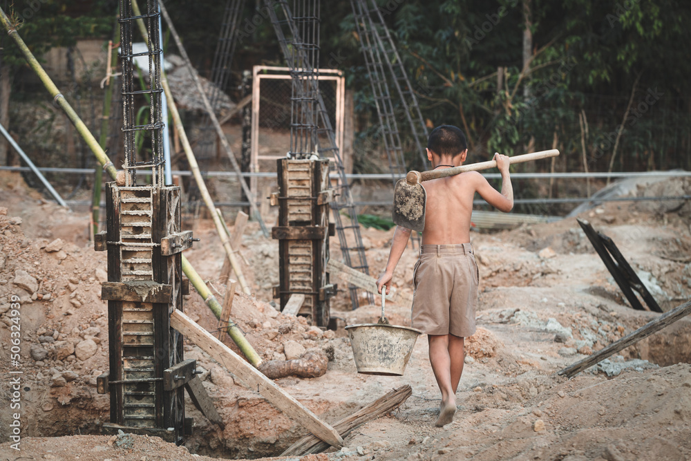 Poor children at the construction site were forced to work. Concept ...