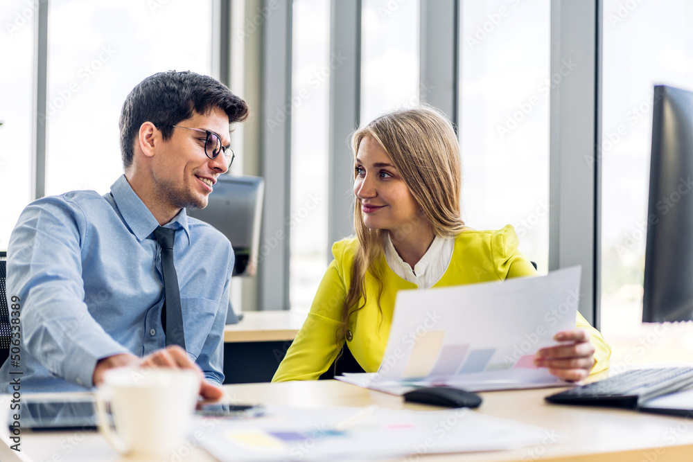 Two professional business man and woman meeting analyzing data and ...