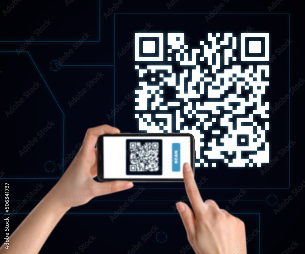 Woman scanning QR code with smartphone on black background, closeup ...