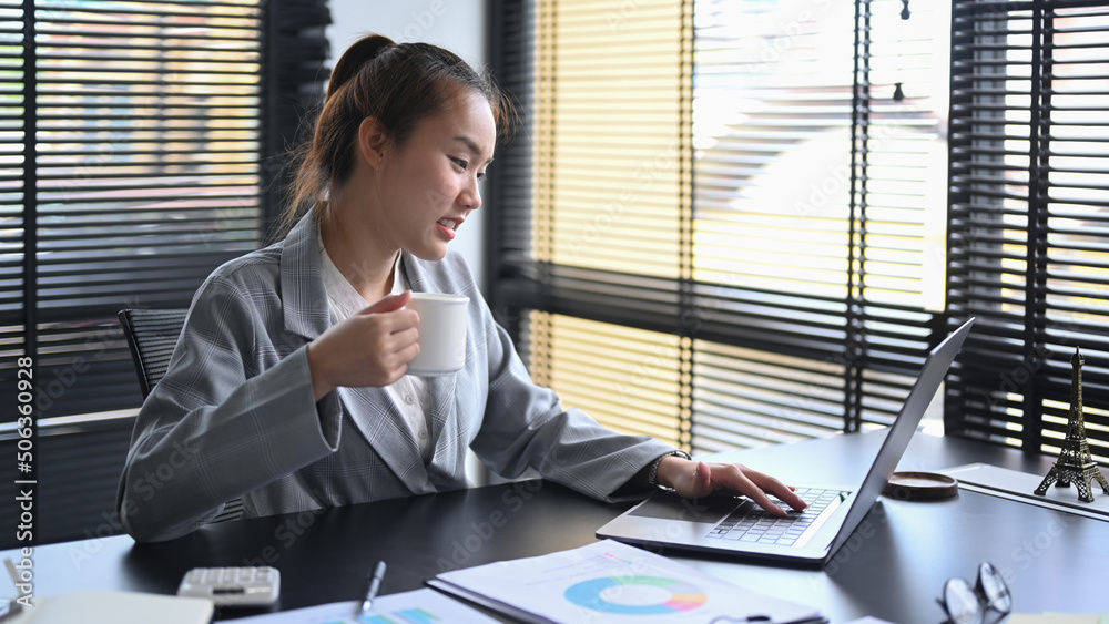 Professional chartered accountant drinking coffee and working with ...