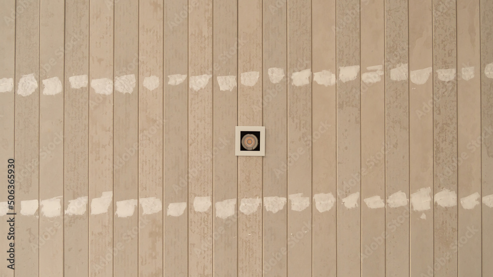 Installing a recessed ceiling light in a modern house under ...