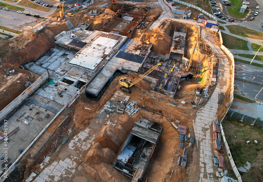 Construction site with tower cranes on construction. Foundation slab ...