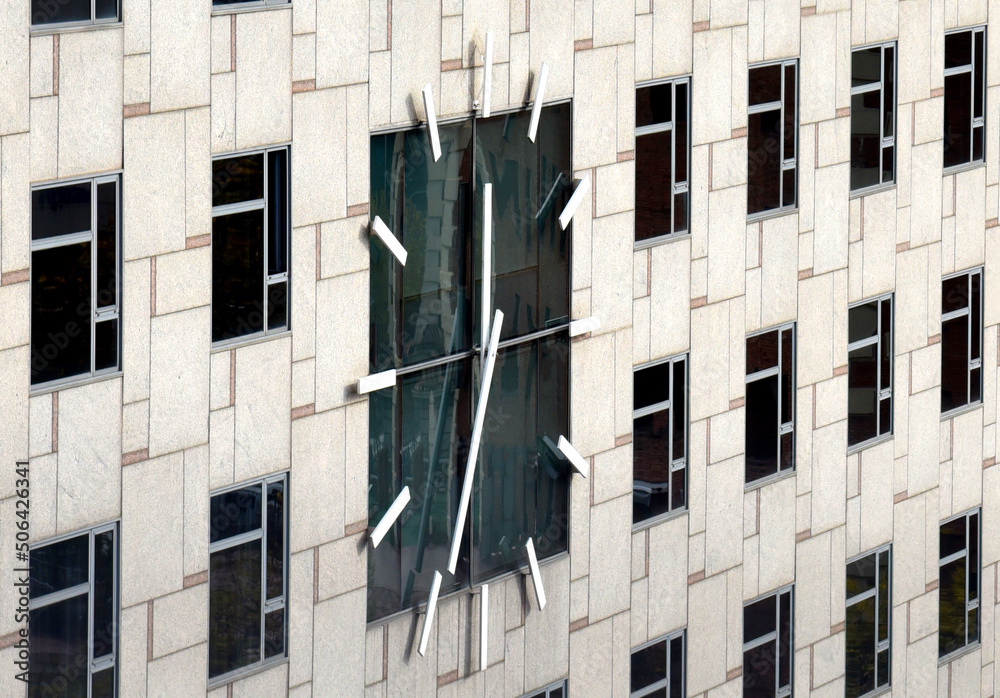 Clock on the building. Large clock tower with hour hands that shows the ...