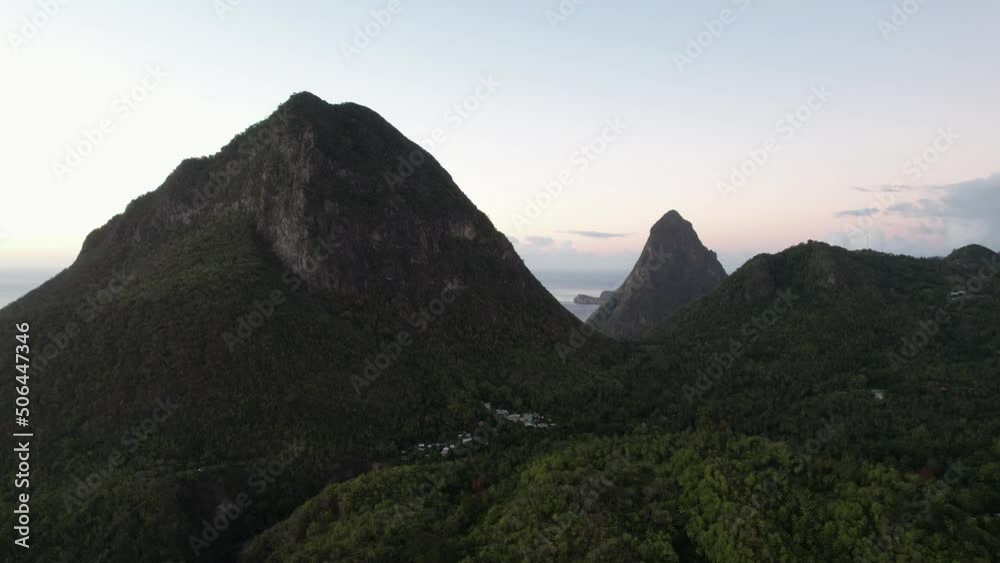 Vidéo Stock Far away aerial view of Saint Lucia's iconic Pitons, with ...